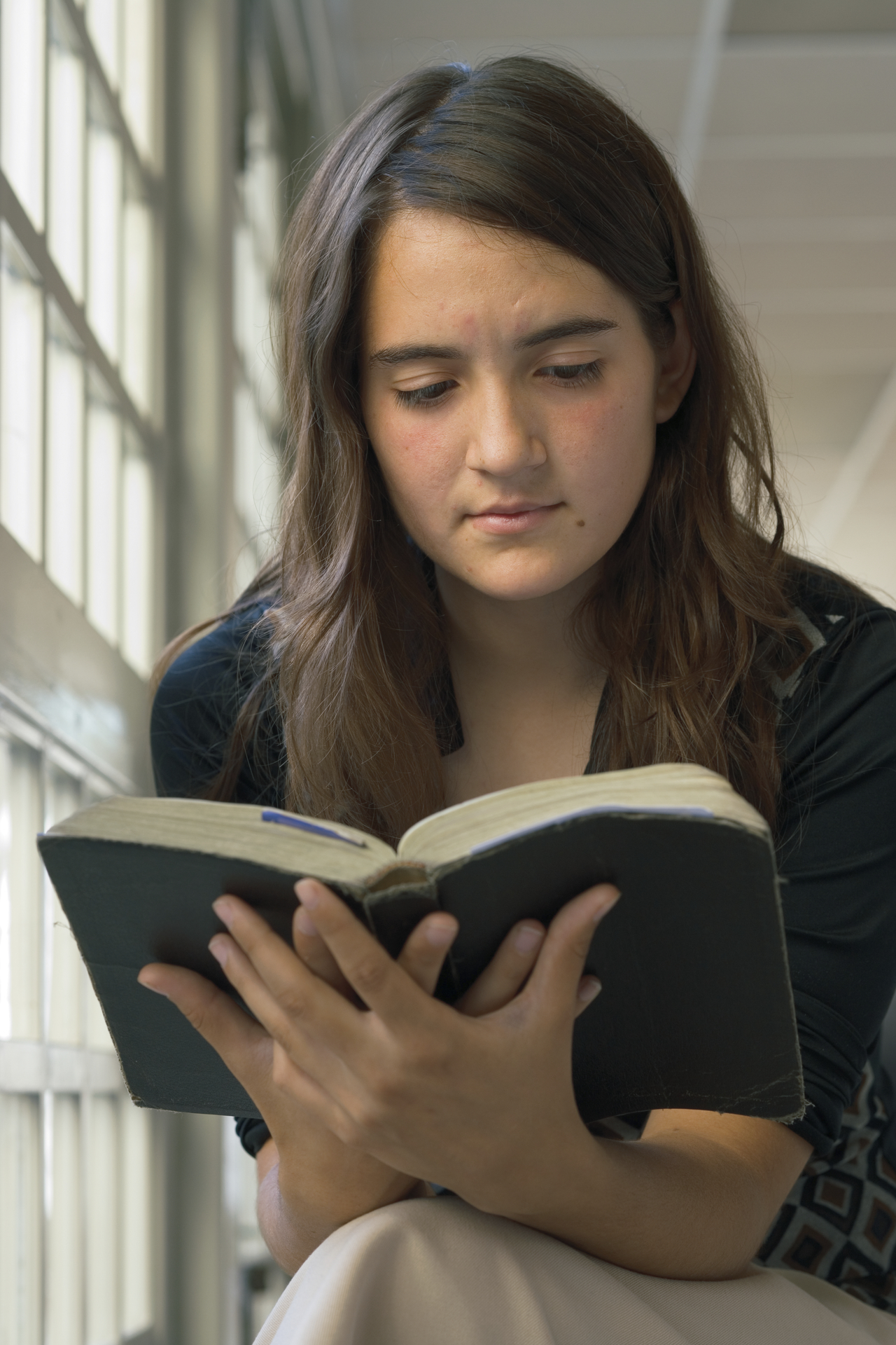 Young Woman Reading Scriptures