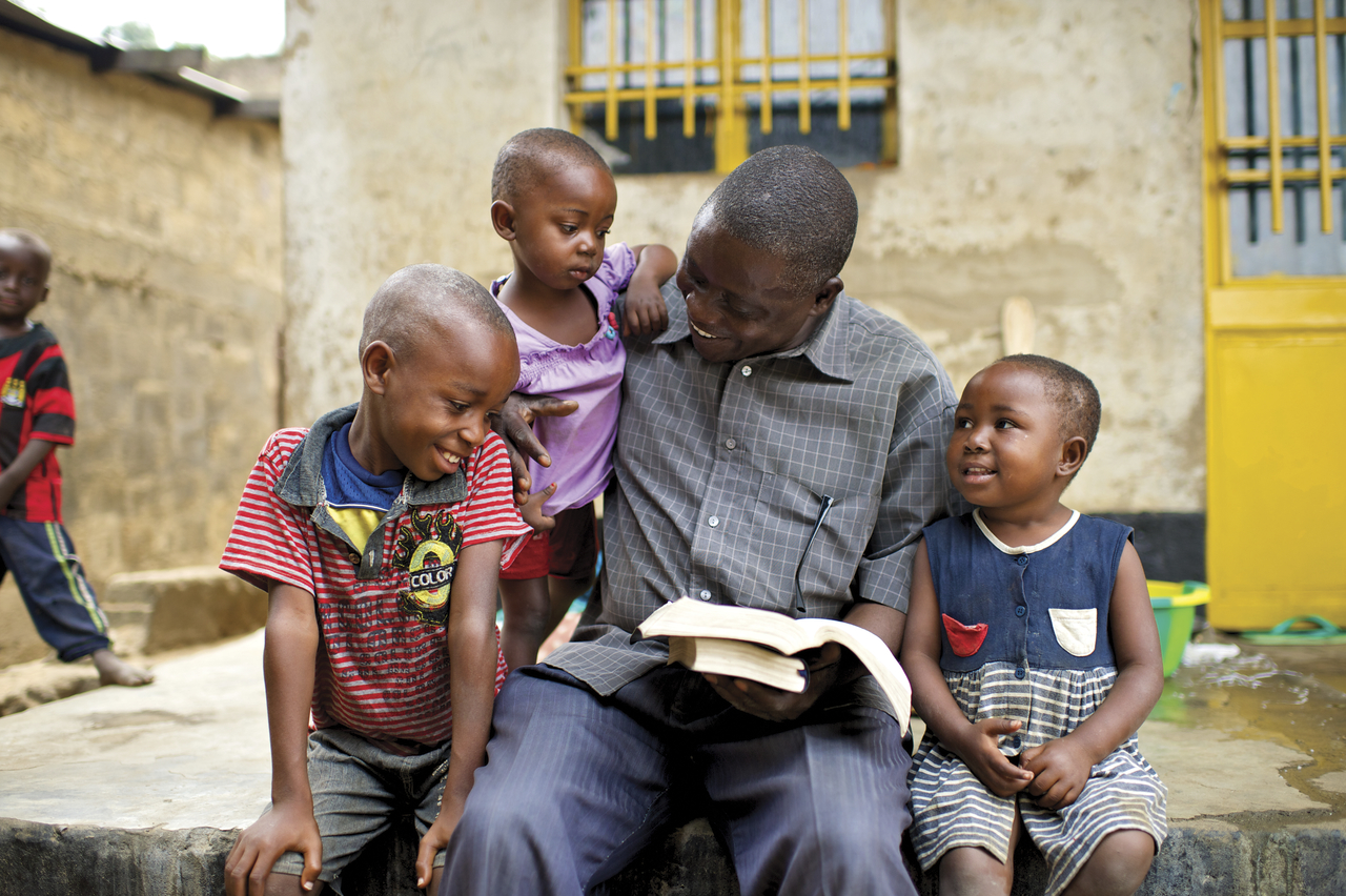 Father and Children Reading the Scriptures