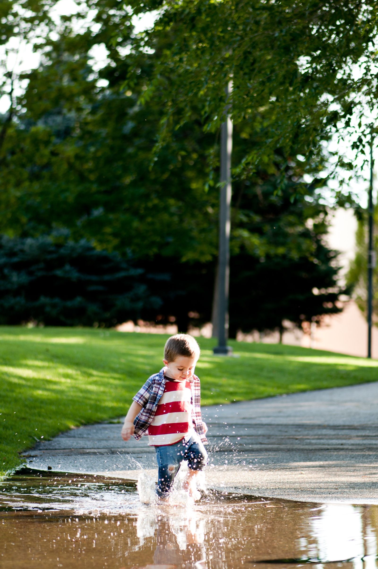 Boy Splashing in a Puddle